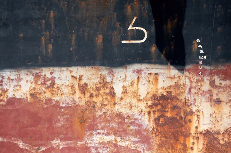 The Rusty Colorful Metal Texture of the Cargo Ship with the Symbol that ...