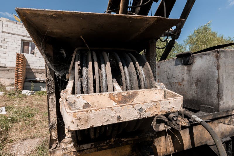 Rusty Construction Winch with Coiled Rope on a Building Site Stock ...