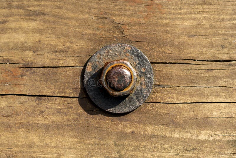 Rusty Corroded Nut with a Washer on a Threaded Bolt on an Old Cracked ...