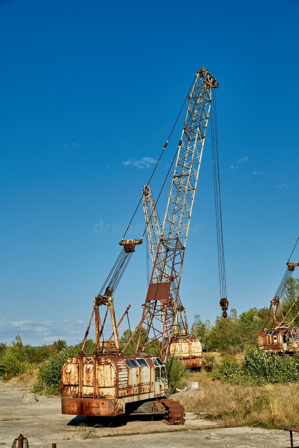 Rusty Cranes in an Abandoned Construction Site. Stock Image - Image of ...