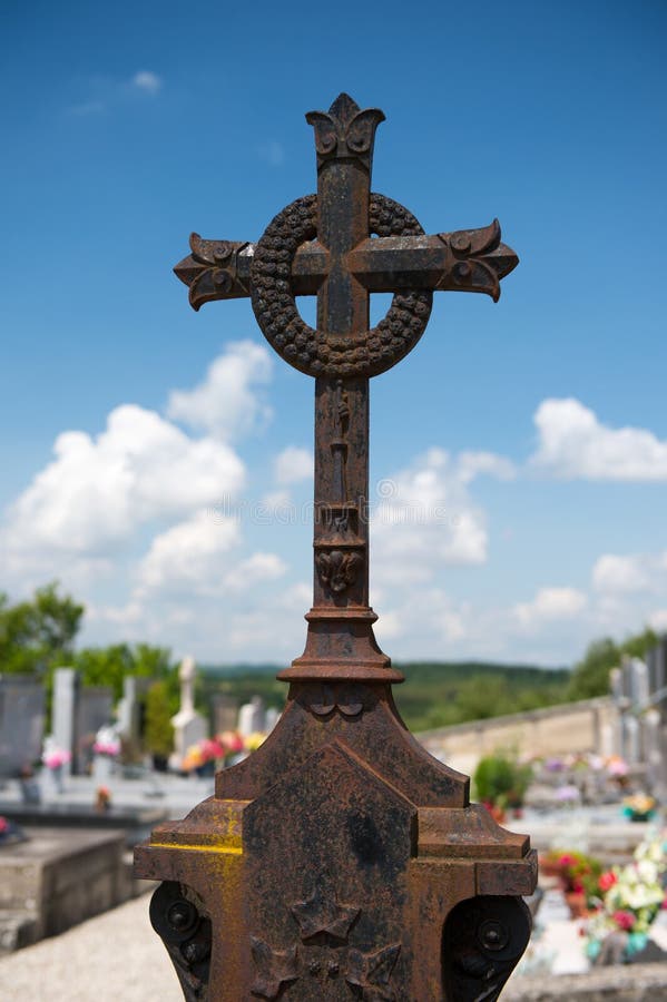 Rusty cross on cemetery stock image. Image of flowers - 38443575