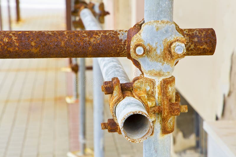 RUSTY and DAMAGED METAL SCAFFOLDING on a CONSTRUCTION SITE BUILT with ...