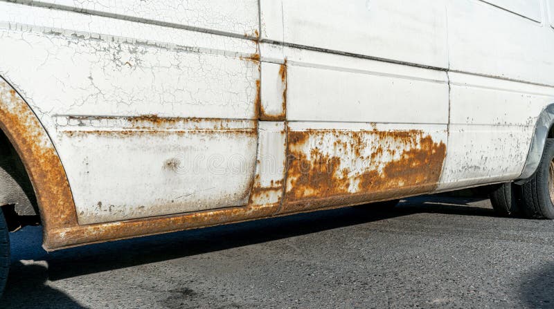 Rusty and Damaged Side of White Van. Vehicle with Visible Rust and ...