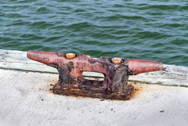 Rusty Dock Cleat stock photo. Image of shipping, rope - 84765502