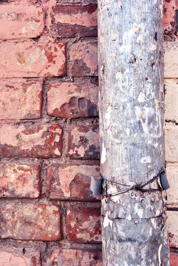 Rusty Drain Pipe with Coiled Wire on Red Brick Wall Stock Photo - Image ...