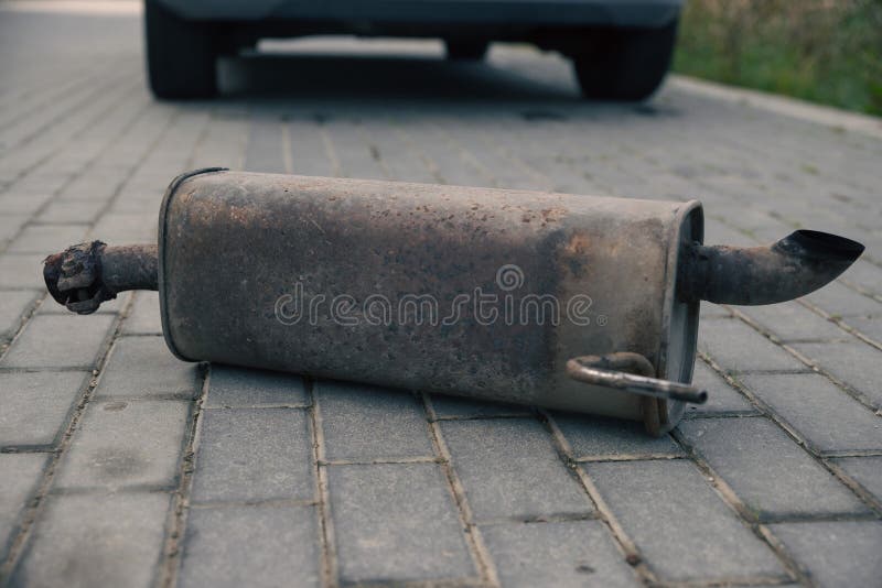 The Rusty Exhaust Pipe, the Car S Muffler Has Fallen Off and is Lying ...