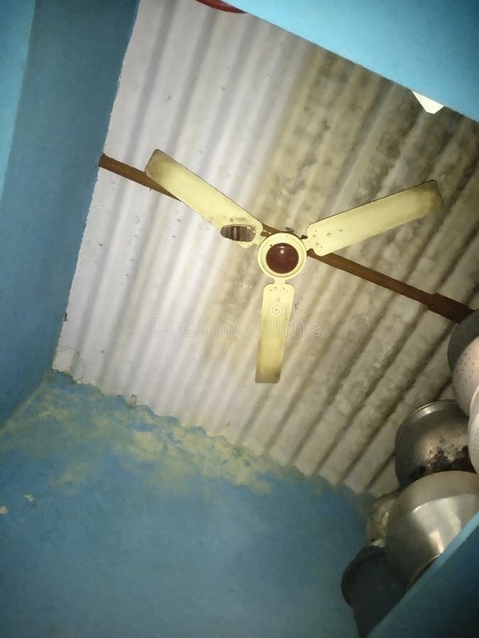 Rusty fan in old house stock photo. Image of wall, yellow - 217075152