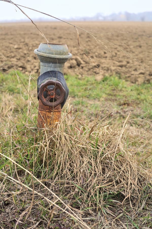 Rusty Faucet in a Field Seen Up Close Stock Image - Image of farmland ...