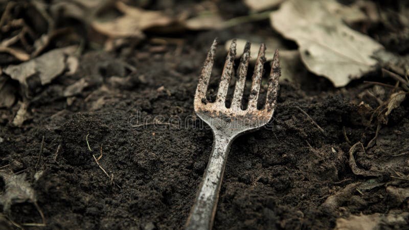 Rusty Fork in Soil stock illustration. Illustration of earth - 377585908