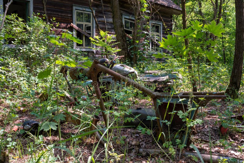 A Rusty Frame from a Motorcycle Against the Background of an Abandoned ...