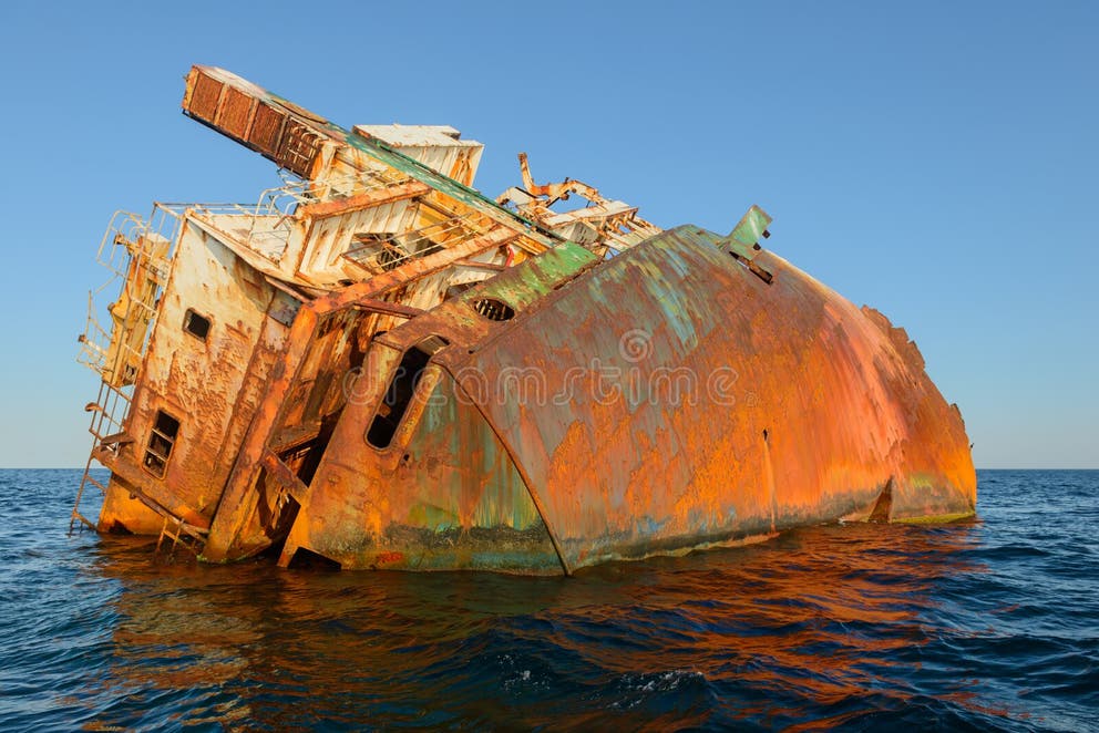 Rusty Frame of a Stranded Naval Ship in the Middle of the Sea Stock ...