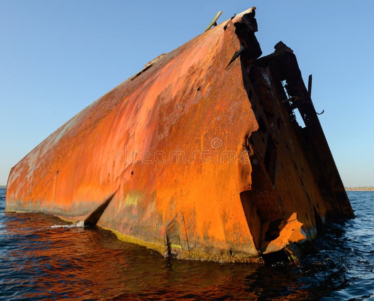 Rusty Frame of a Stranded Naval Ship in the Middle of the Sea Stock ...