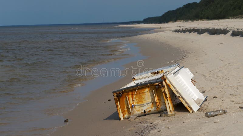 Rusty Fridge on a Beach. Environment Pollution Concept Stock Image ...
