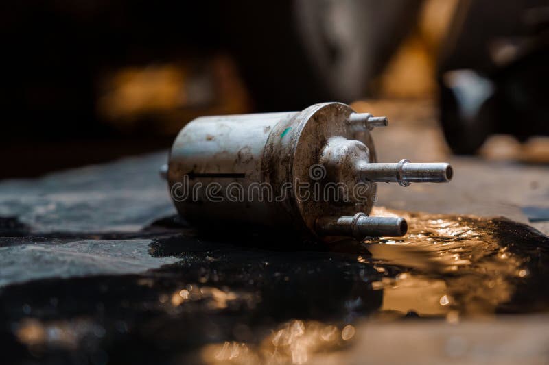 Rusty Fuel Filter on a Workshop Floor with Spill Stock Photo - Image of ...