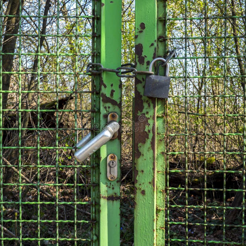 Rusty Gate and Lock on a Garden that Has Been Abandoned Stock Photo ...