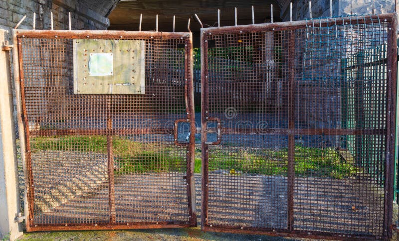Rusty gates at a compound stock image. Image of locked - 182968097