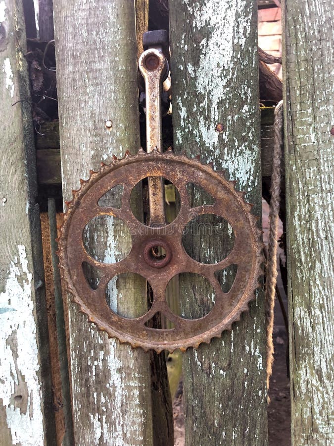 Rusty gear on the boards stock photo. Image of industrial - 146330576
