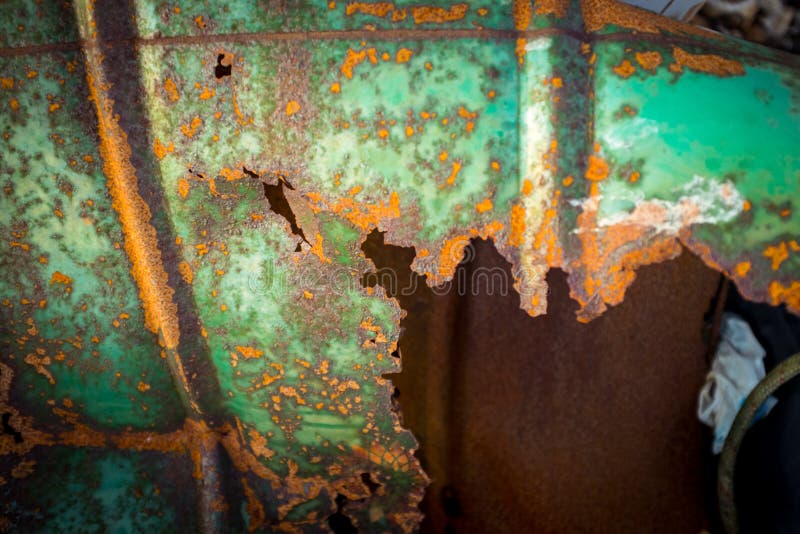 A Rusty Green Barrel with Holes Stock Image - Image of modern, beach ...