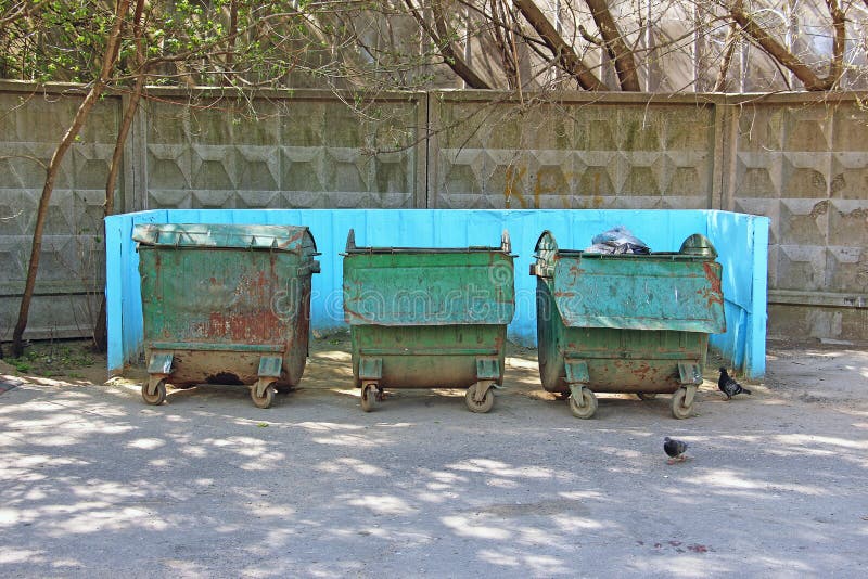Rusty Green Garbage Cans in the Trash Stock Photo - Image of debris ...