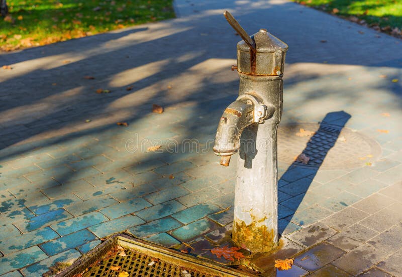 Rusty Hand Pump of the Public Water Well Stock Photo - Image of ...
