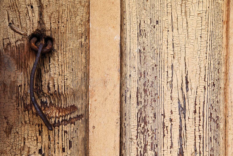Rusty hinge on yellow door stock photo. Image of building - 79815822