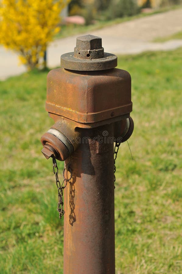 Old Rusty Hydrant in Front of Natural Stone Wall in an Oblique Camera ...