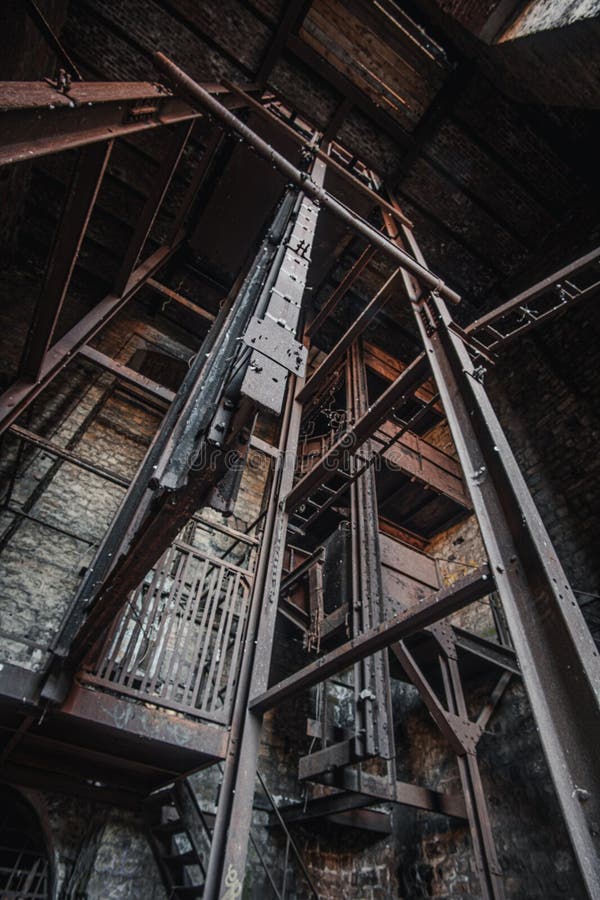 Rusty Industrial Elevator Shaft in Abandoned Belgian Factory – Vertical ...