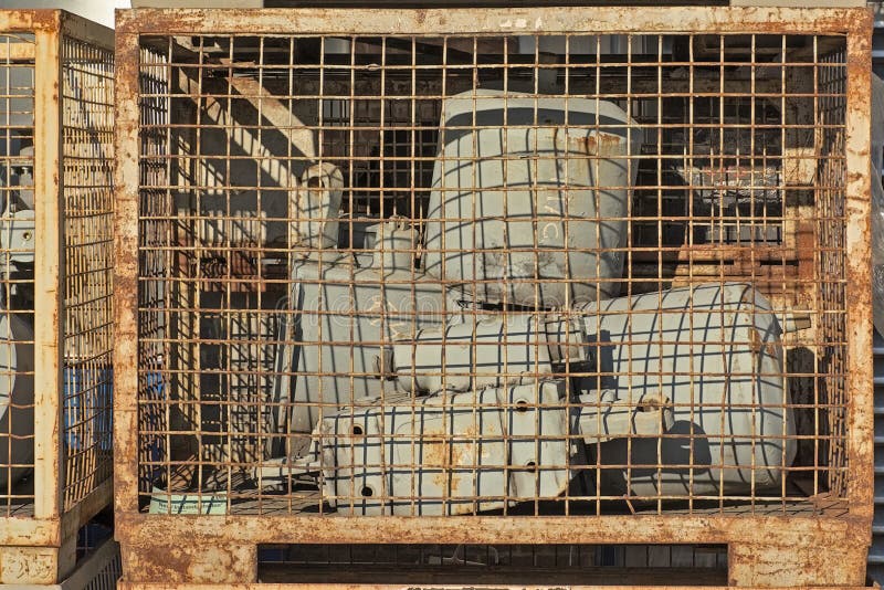 Rusty Metal Wire Mesh Container with Train Components Stock Photo ...