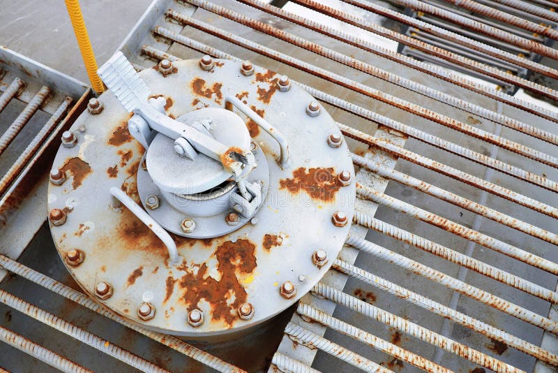 Rusty Industrial Pipe Cap with Safety Ladder on Metal Grating Stock ...