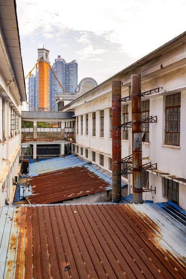 Rusty Industrial Workshop Buildings and Chimneys in an Old Industrial ...