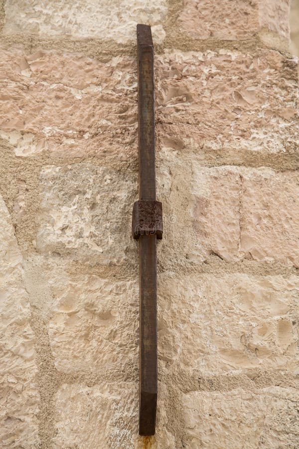 Rusty Iron Bar on Old Stone Wall Stock Photo - Image of weathered ...