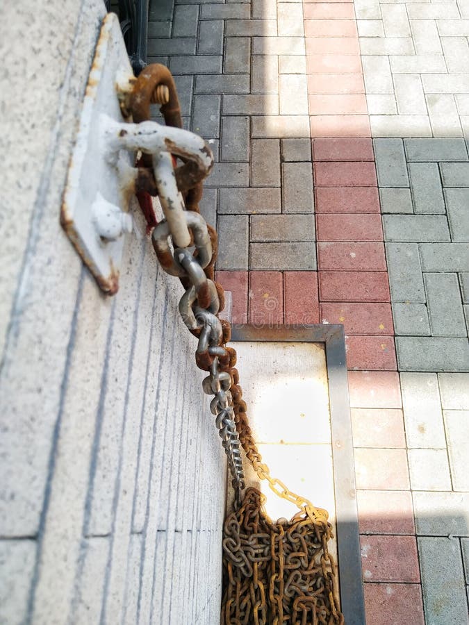 Rusty Iron Chain Attached To the Wall of a Building Stock Image - Image ...