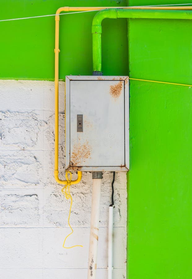 Rusty Iron Control Box on White and Green Concrete Wall Stock Photo ...
