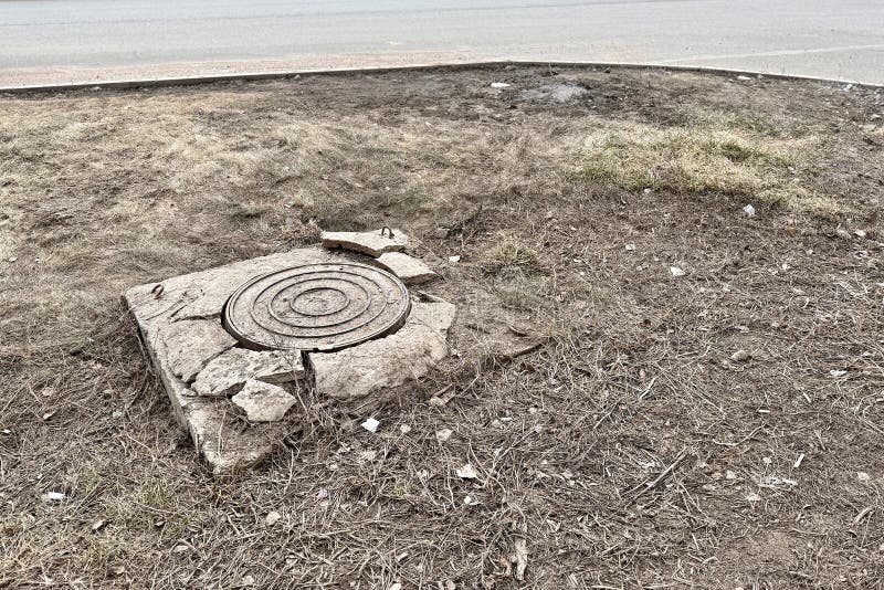 A Rusty Iron Hatch with a Pattern and a Large Gap at the Top is Mounted ...