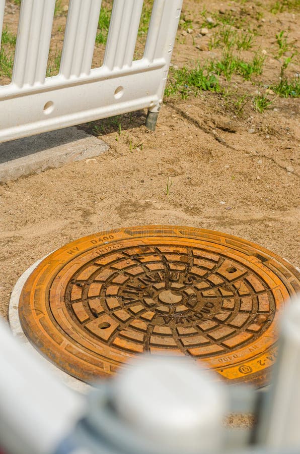 Rusty Iron Manhole Cover in a Ditch Stock Image - Image of repairs ...