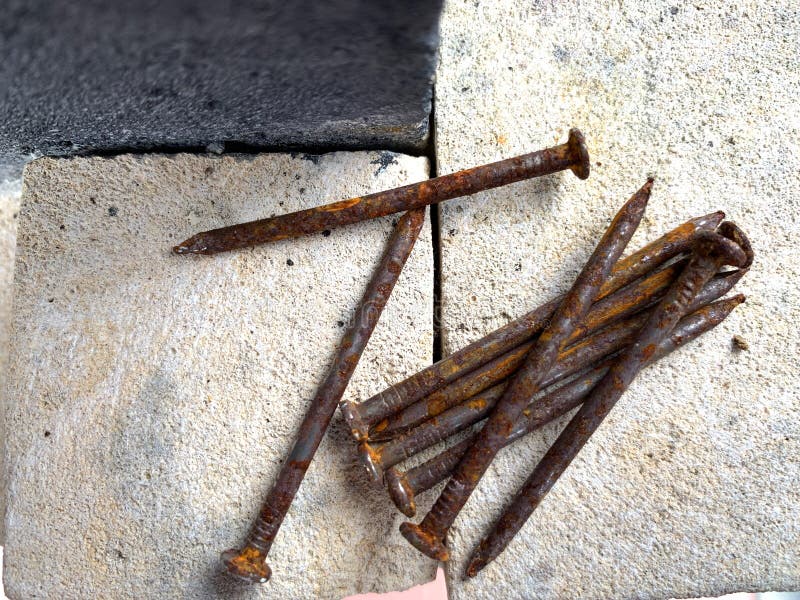 Rusty Iron Nails Were Placed on the Wall Stock Photo - Image of ...