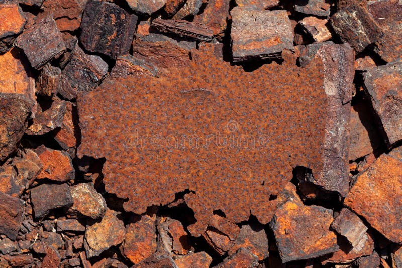 Rusty Iron Plate Against a Background of Rusty Pieces of Metal. Design ...