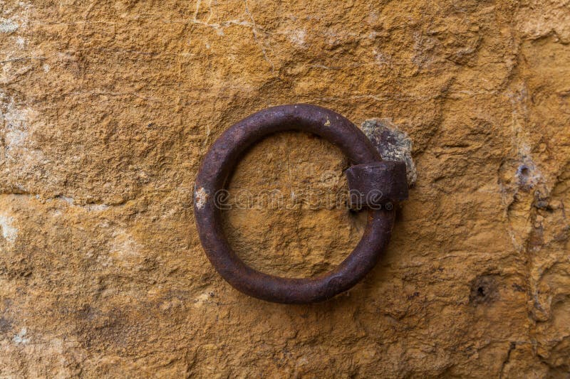 A Rusty Iron Ring is Mounted on a Stone Wall Stock Photo - Image of ...
