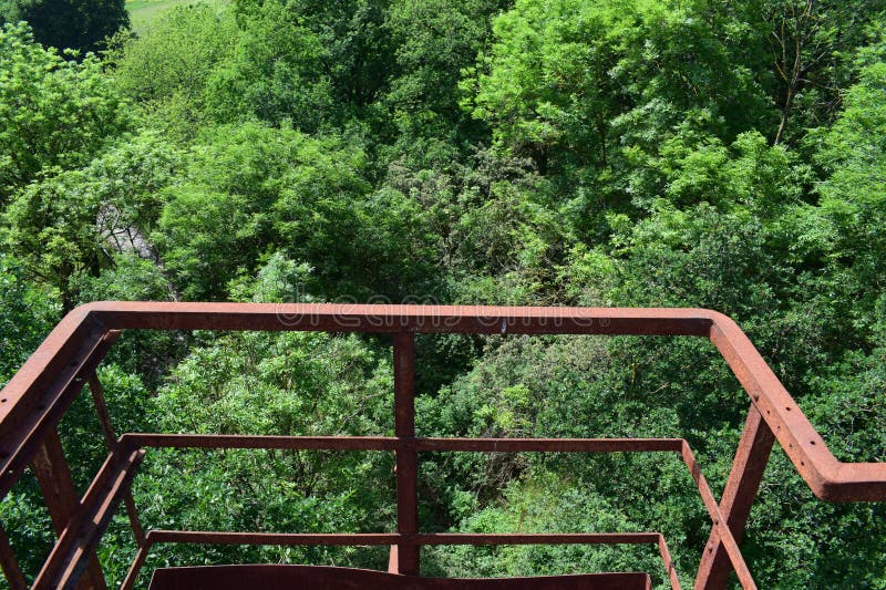 Rusty Iron on a Bridge Above Spring Green Trees Stock Photo - Image of ...