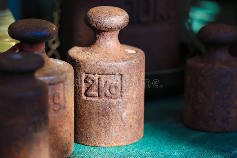 Rusty 2 kilogram weight stock photo. Image of measure - 298446568