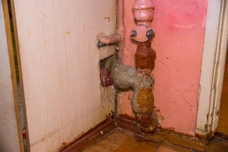 A Rusty Leaking Battery in an Old Flat. Stock Image - Image of ...