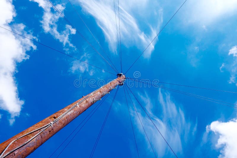 Rusty Light Pole from Below with Light Cables into Blue Sky Stock Photo ...