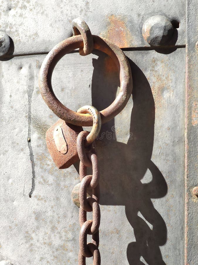 Rusty Lock and Chain on Metal Door Stock Photo - Image of lock, horn ...