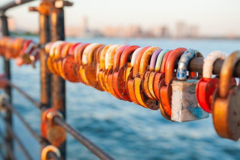 Rusty Love Locks Line a Seaside Railing, Symbolizing Romantic Gestures ...