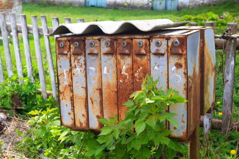 Rusty mailboxes stock photo. Image of rust, village, mailbox - 53581052