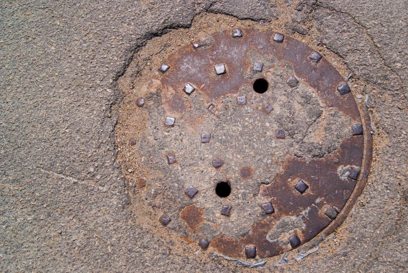 Rusty Manhole Set in Road Man Hole Stock Image - Image of sewer, rain ...