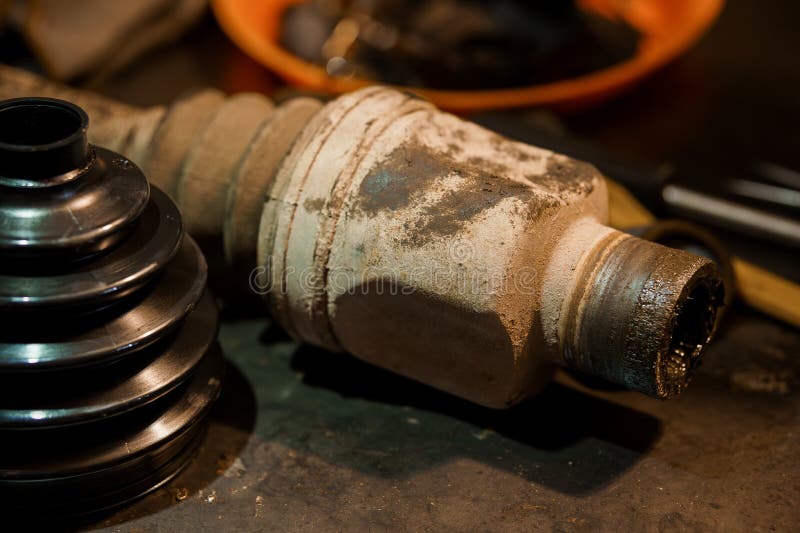 Rusty Mechanical Cv Joint Component Surrounded by Workshop Tools and ...
