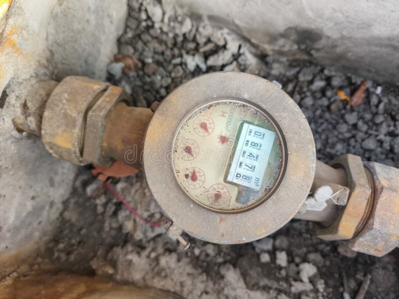 Rusty, Mechanical Water Meter with a Glass-covered Dial Displays ...