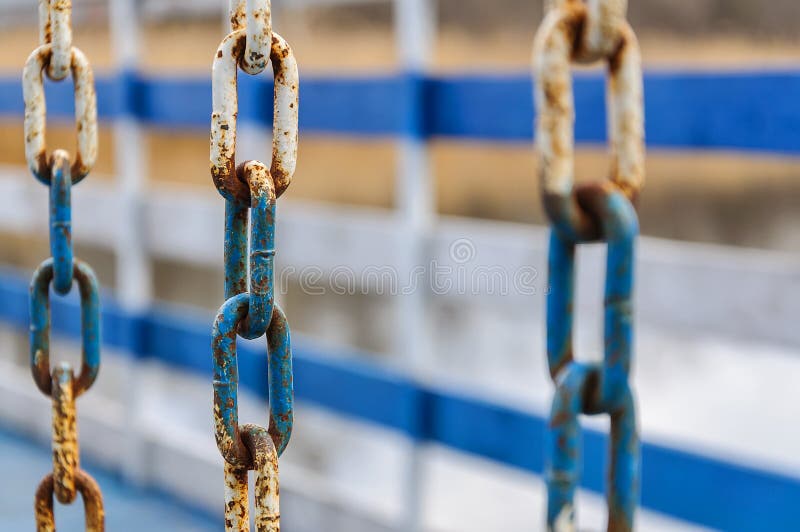 Rusty Metal Chain on a White and Blue Fence Stock Image - Image of ...