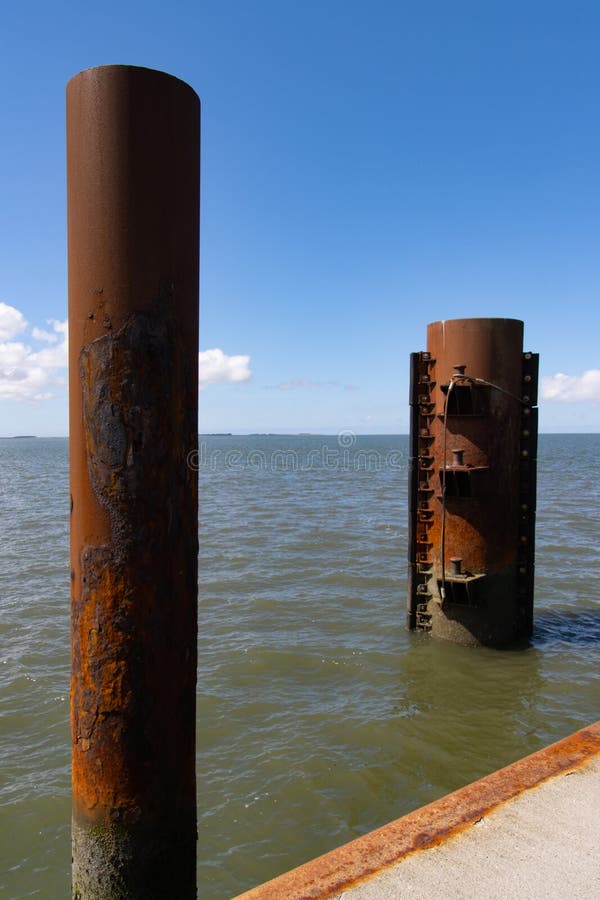 Rusty Metal Dolphin or Mooring Post in a Harbor Stock Image - Image of ...